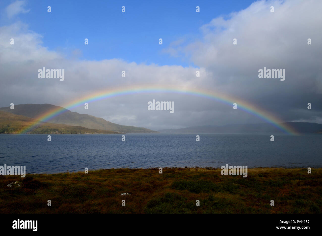 Beautiful highlands in Scotland with a full rainbow Stock Photo - Alamy