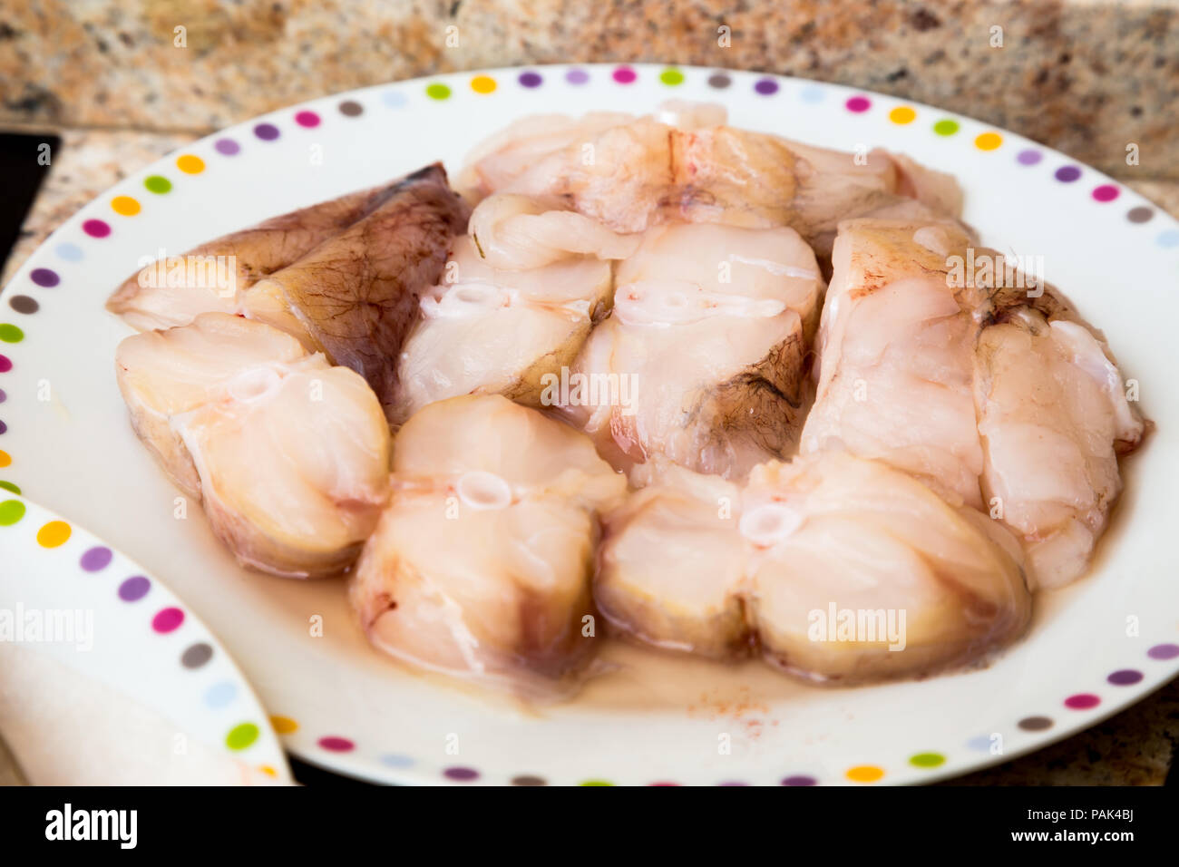 plate with raw monkfish tails, prepared in the kitchen Stock Photo - Alamy