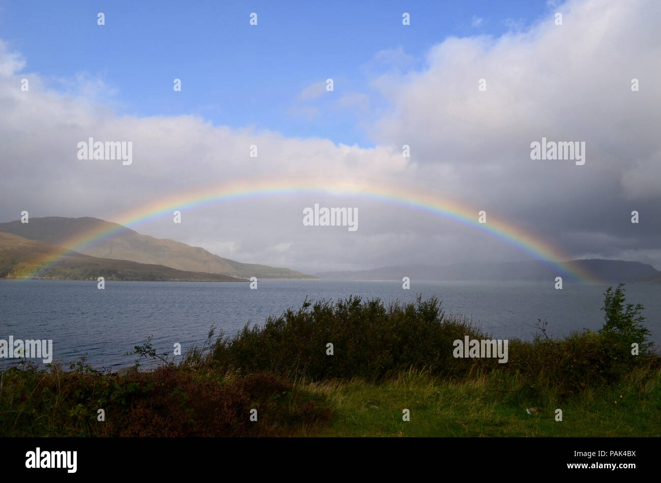 Captivating view of a full rainbow in the waters in Scotland Stock ...