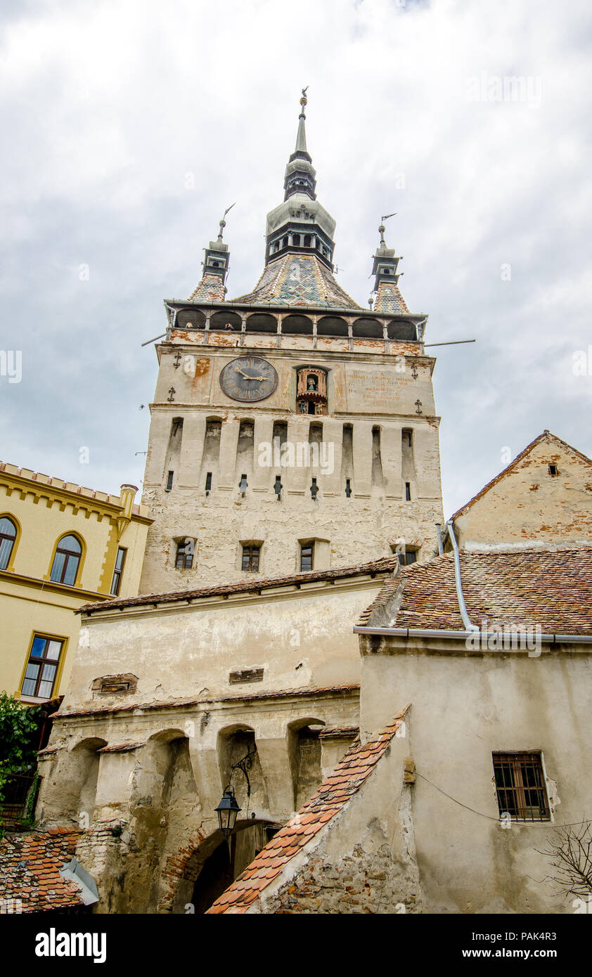 Clock Tower in Sighisoara with many old buildings in this beautiful ...