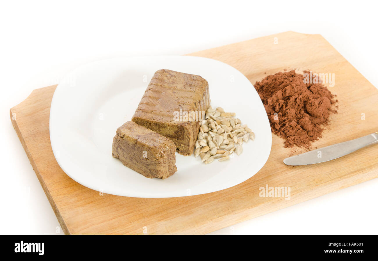 Halva traditional turkish bulgarian green romanian dessert with sunflower seeds and cocoa powder ...