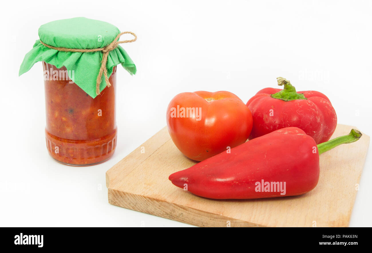 Traditional romanian vegetable preserve called zacusca in a jar with ...