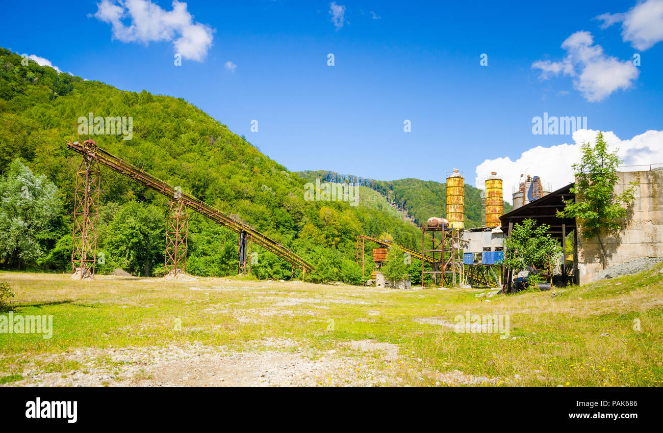 Old cement factory mine abandoned and forgoten in a desserted area with ...