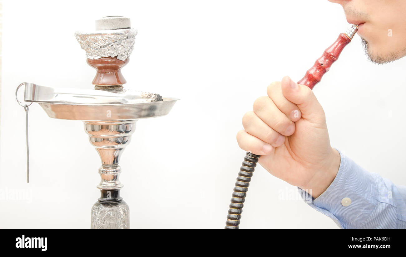 Man smoking a shisha or hookah Stock Photo - Alamy