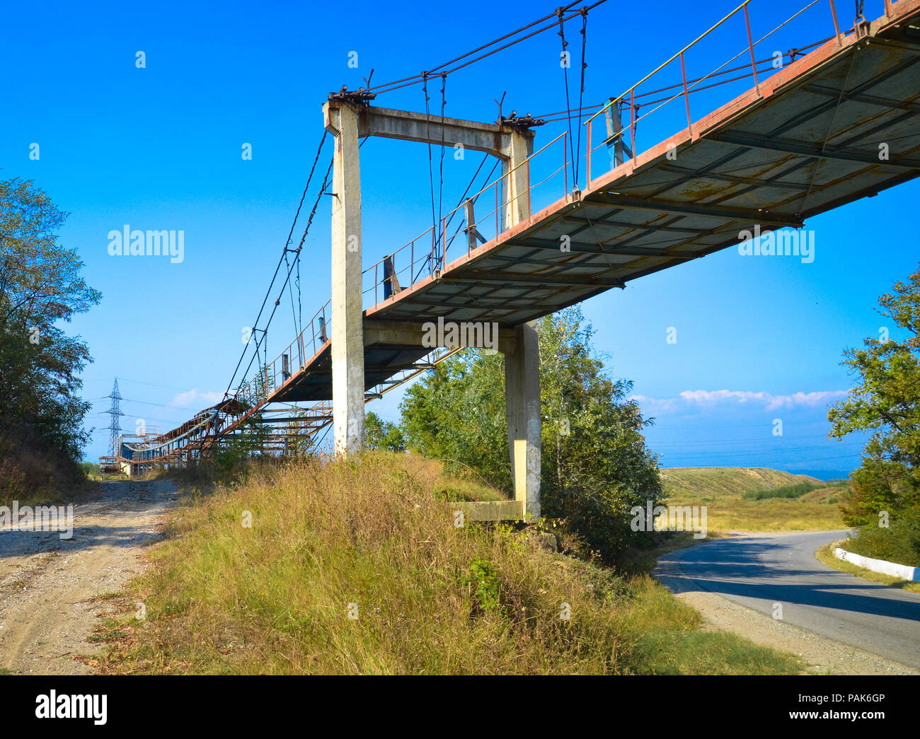 Old industrial bridge abandoned with rusty metal and concrete on a ...