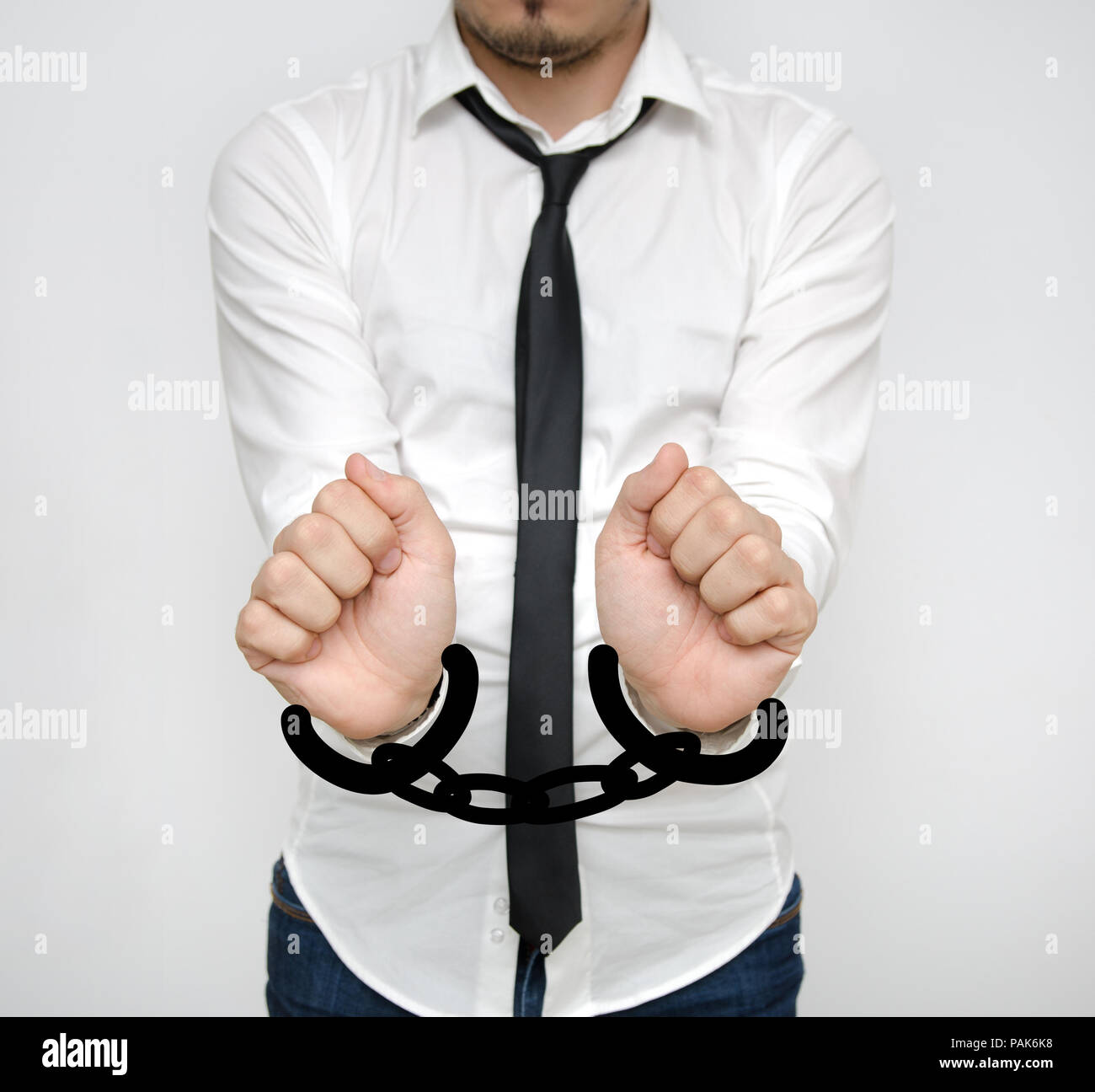 Man handcuffed suit hi-res stock photography and images - Alamy