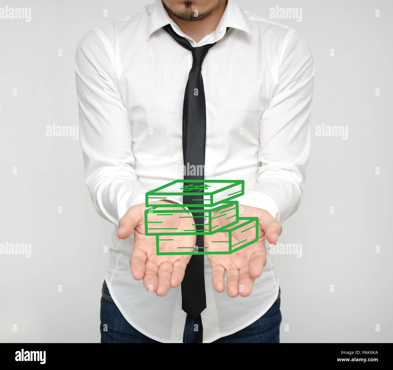 A young rich business man entrepreneur with a stack of money in his ...