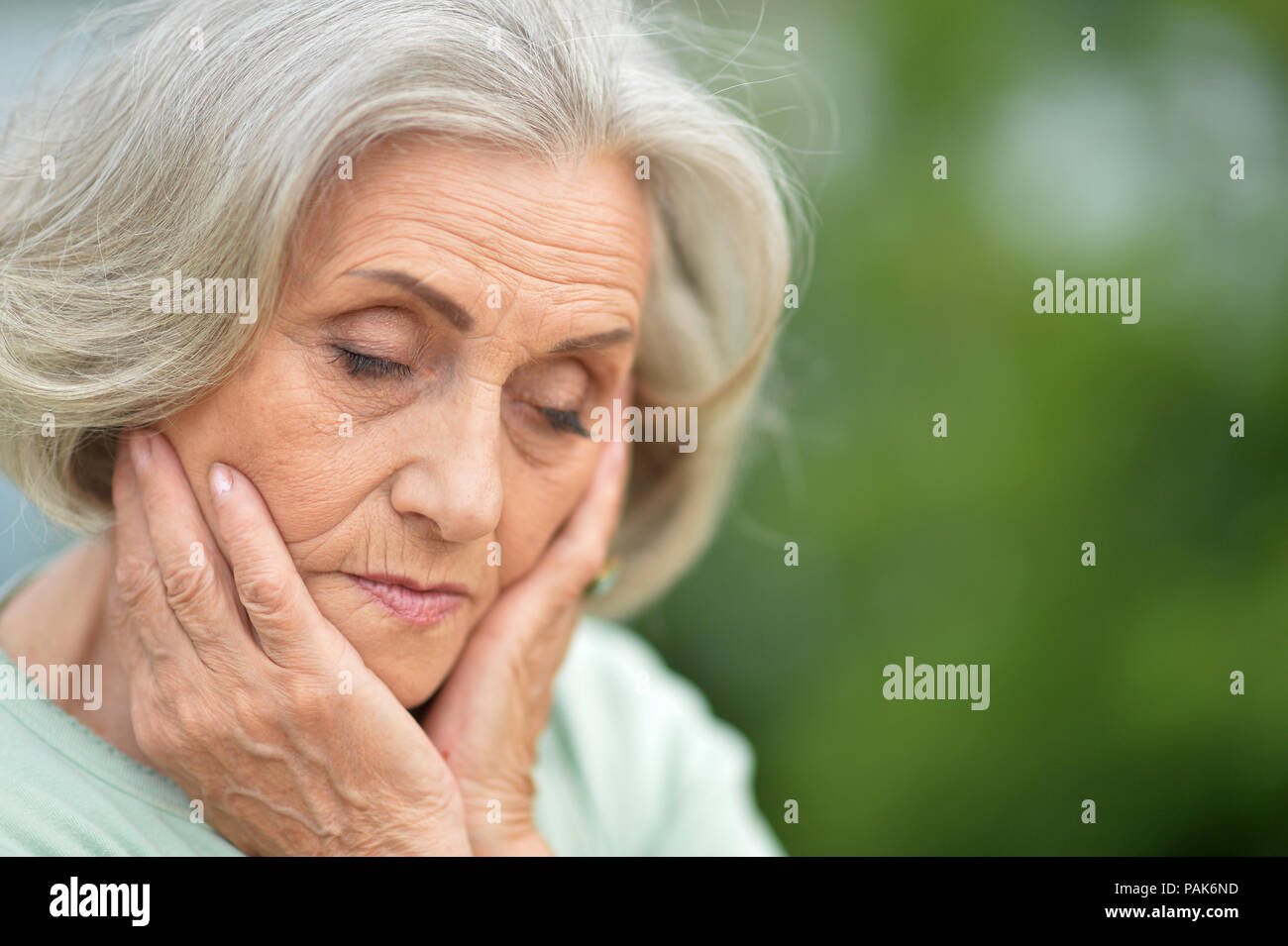 beautiful sad senior woman Stock Photo - Alamy