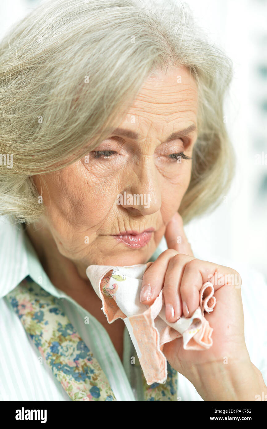 Sad senior woman Stock Photo - Alamy