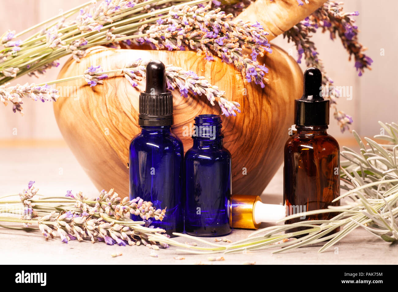 lavender mortar and pestle and bottles of essential oils for aromatherapy Stock Photo - Alamy