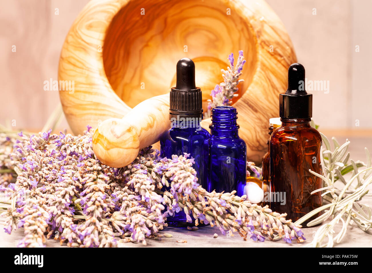 lavender mortar and pestle and bottles of essential oils for aromatherapy Stock Photo - Alamy