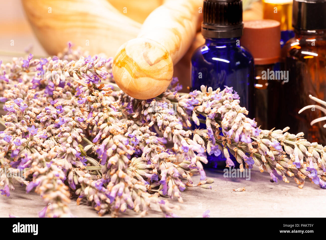 lavender mortar and pestle and bottles of essential oils for aromatherapy Stock Photo - Alamy