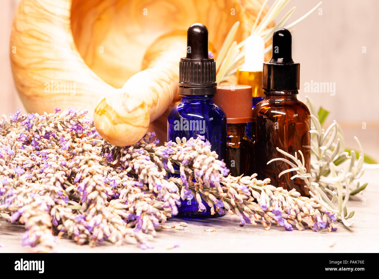 lavender mortar and pestle and bottles of essential oils for aromatherapy Stock Photo - Alamy