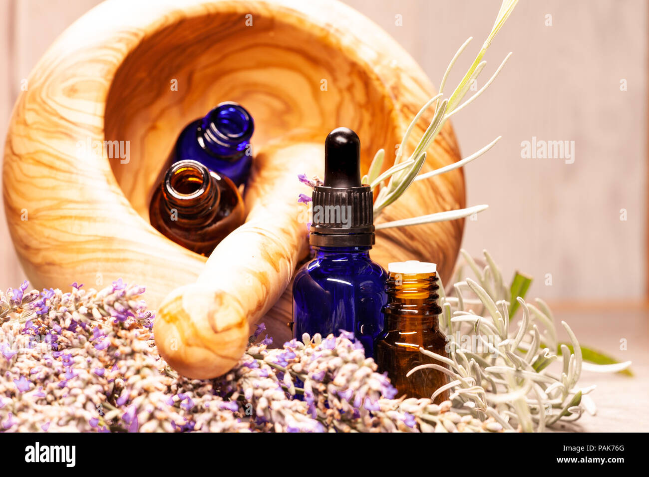 lavender mortar and pestle and bottles of essential oils for aromatherapy Stock Photo - Alamy