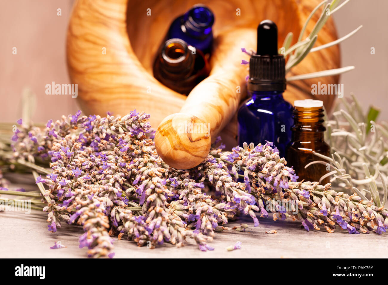 lavender mortar and pestle and bottles of essential oils for aromatherapy Stock Photo - Alamy