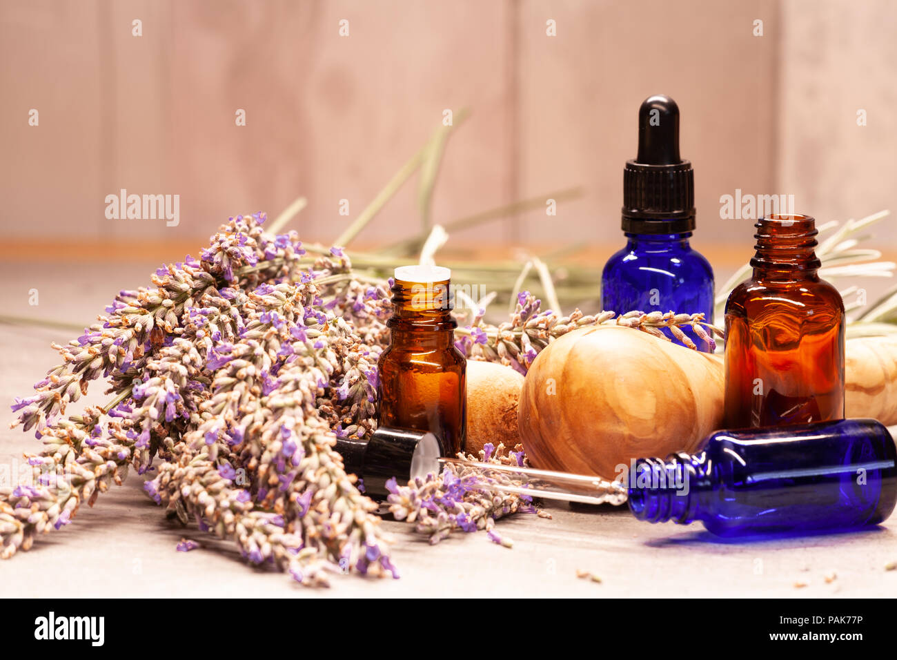 lavender mortar and pestle and bottles of essential oils for aromatherapy Stock Photo - Alamy