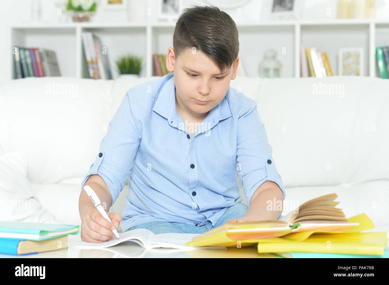 boy doing homework Stock Photo - Alamy