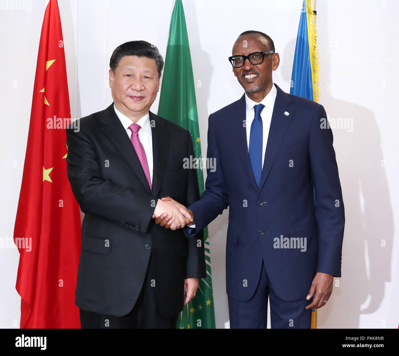 Kigali, Rwanda. 23rd July, 2018. Chinese President Xi Jinping (L) holds ...
