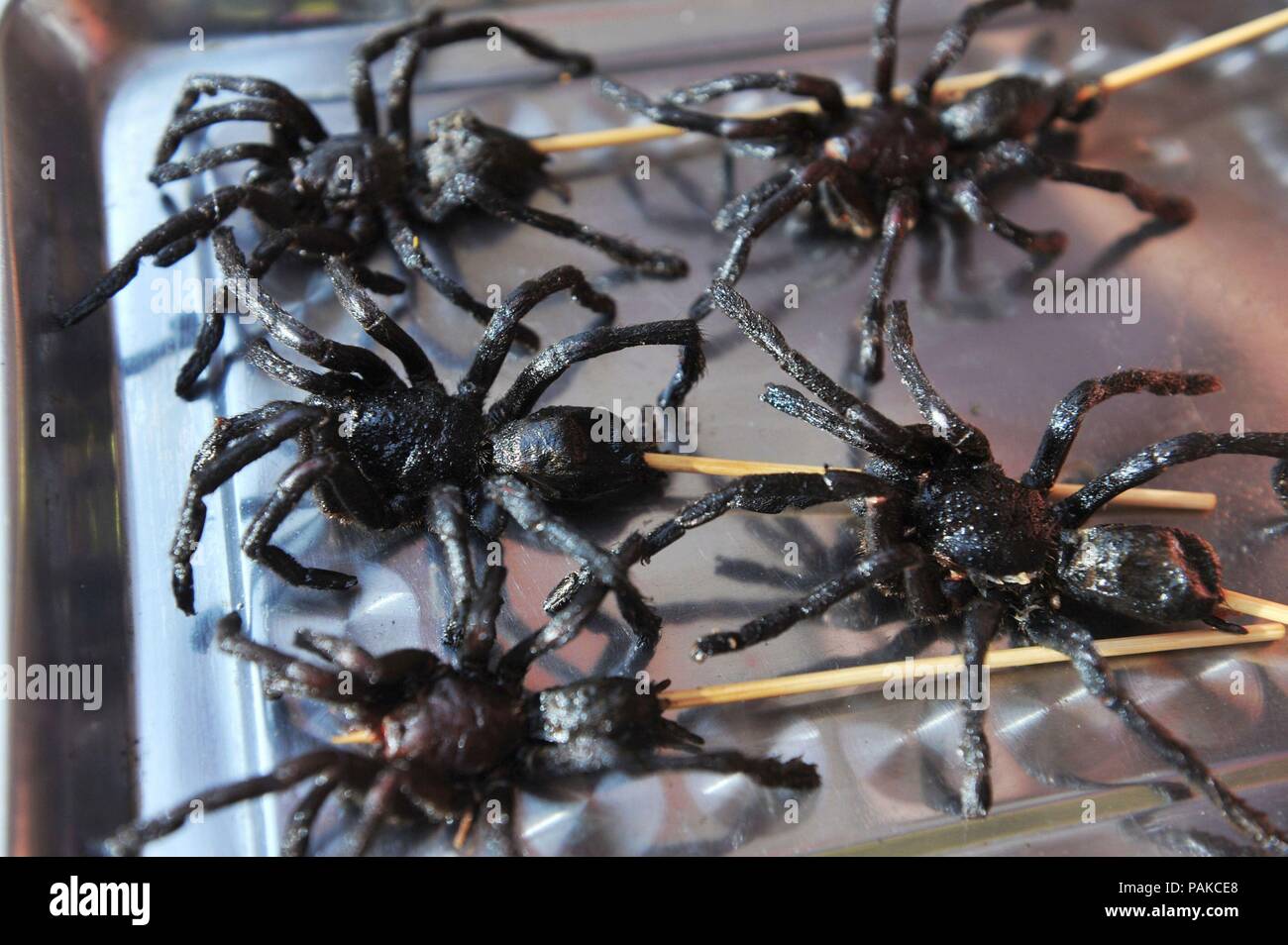 China. 24th July, 2018. Qingdao, CHINA-Fried insects including ...