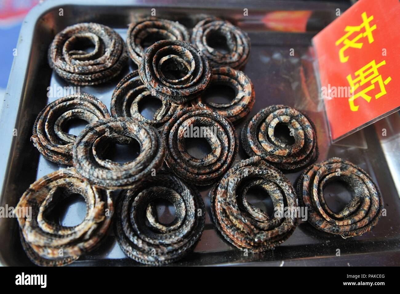 China. 24th July, 2018. Qingdao, CHINA-Fried insects including ...