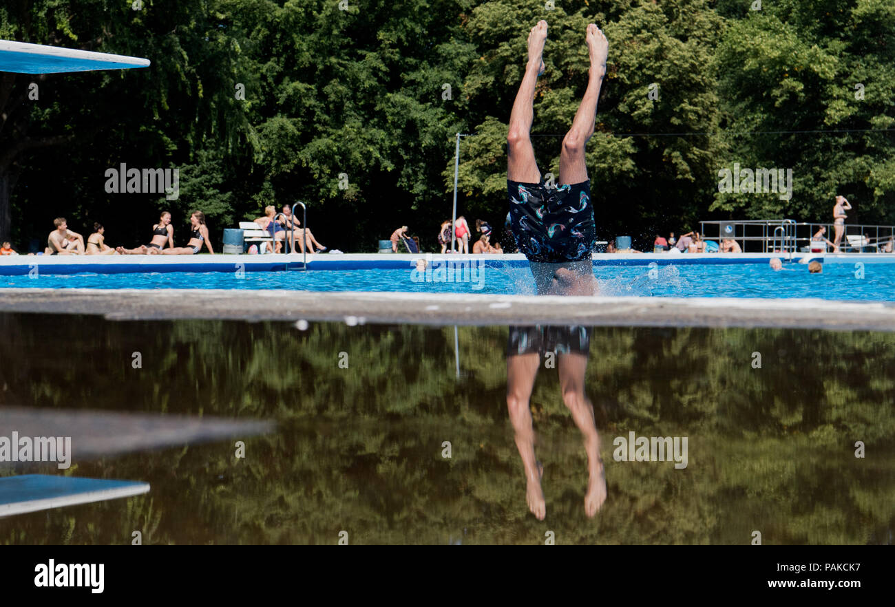 Hanover, Germany. 18th July, 2018. A visitor jumps into the water at ...