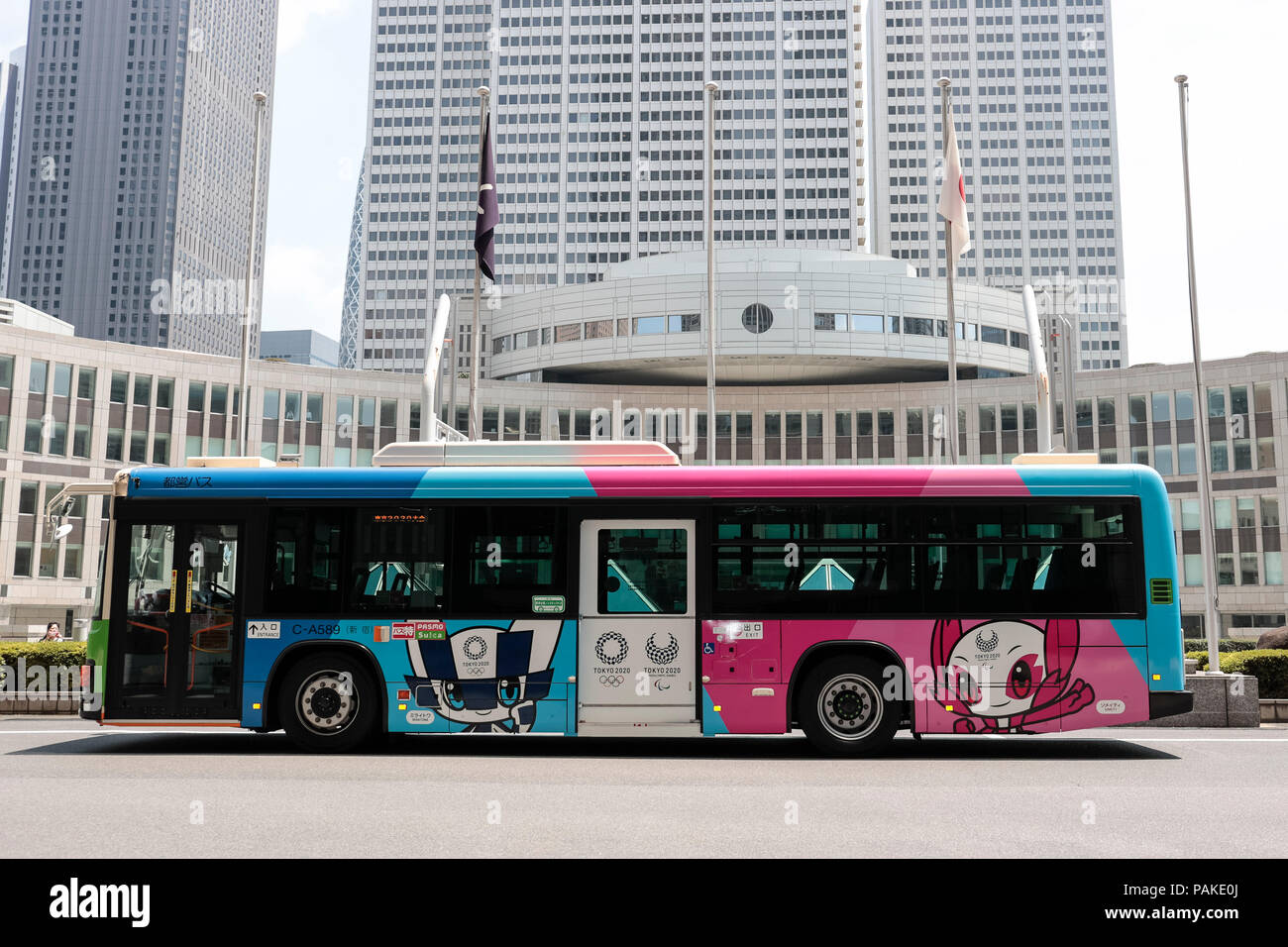 A public bus decorated with illustrations of the official mascots for ...