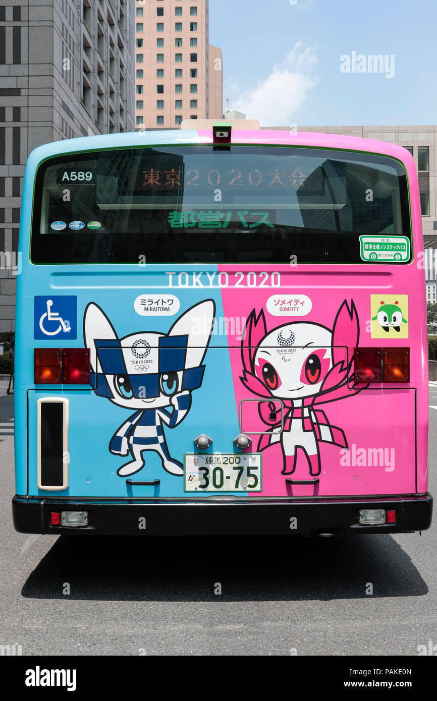 A public bus decorated with illustrations of the official mascots for ...