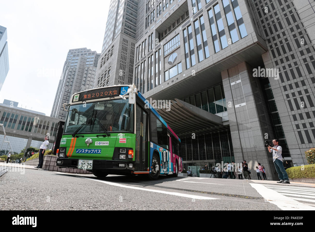 A public bus decorated with illustrations of the official mascots for ...