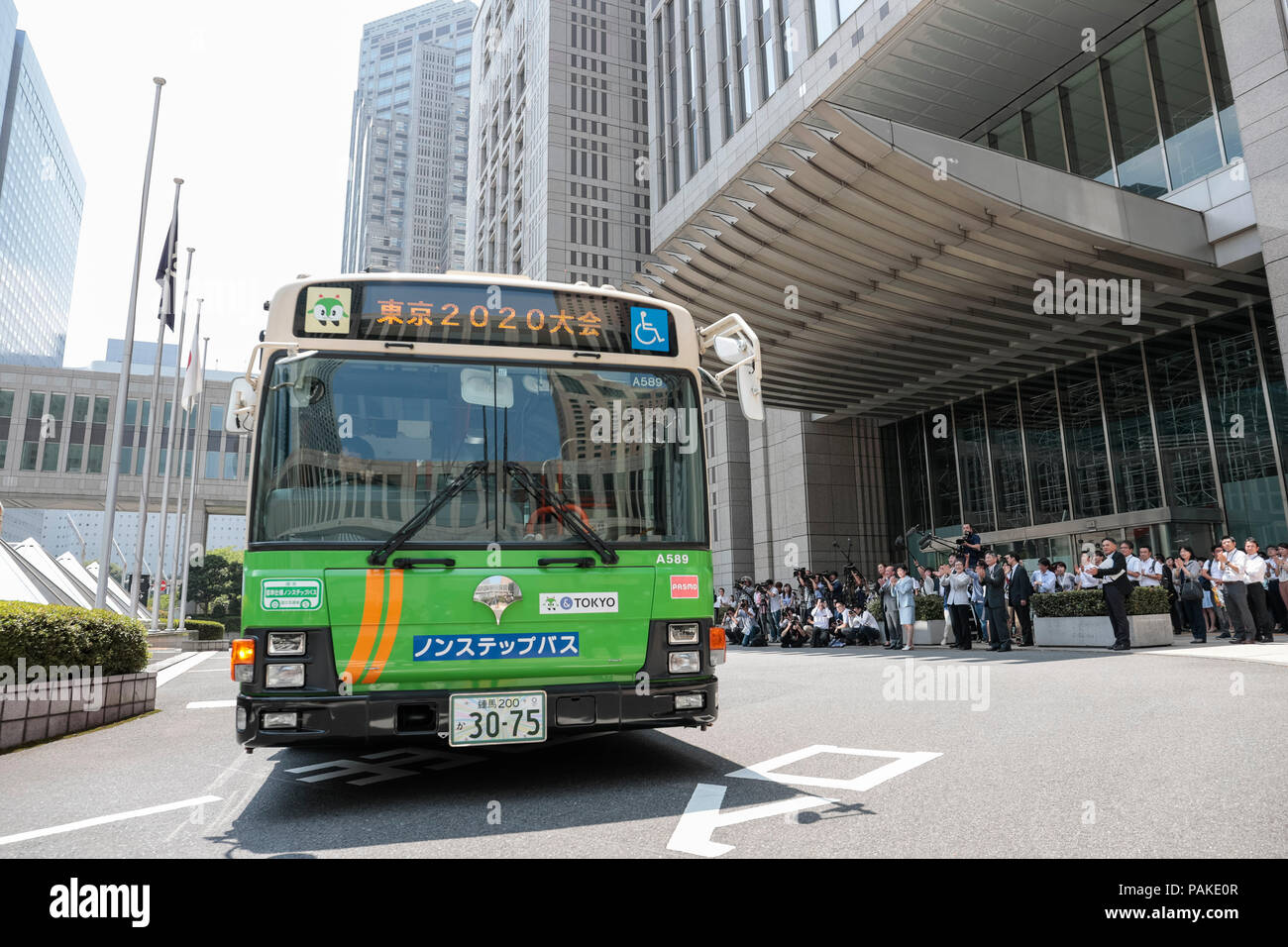 A public bus decorated with illustrations of the official mascots for ...