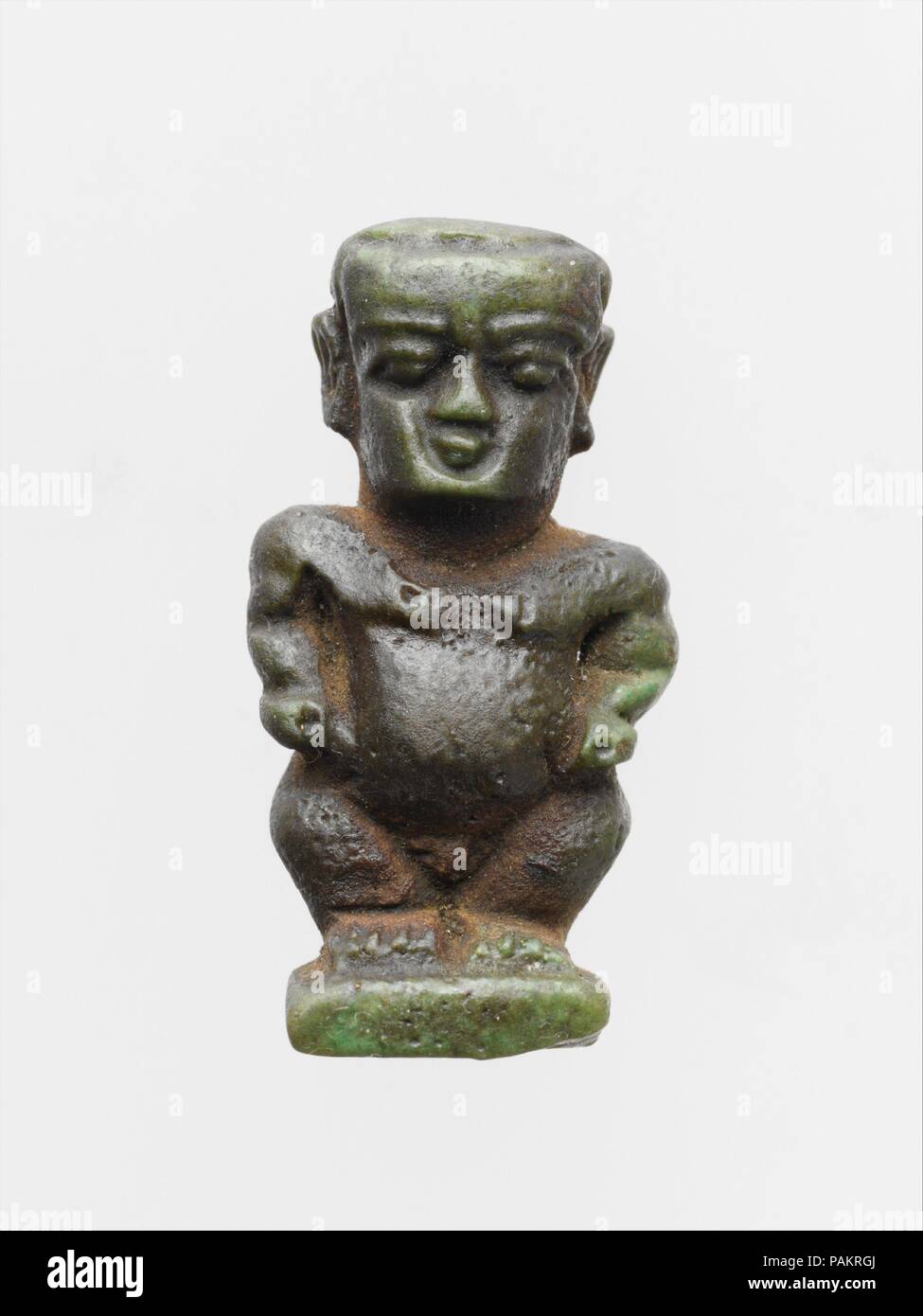 Faience amulet in the form of the dwarf god Pataikos. Culture: Egyptian ...