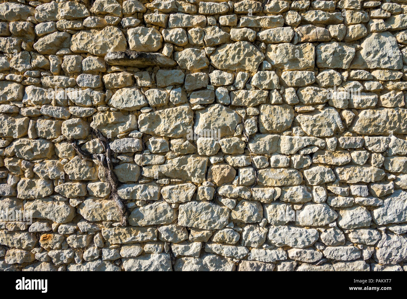 Textured wall of old stone barn, France Stock Photo - Alamy