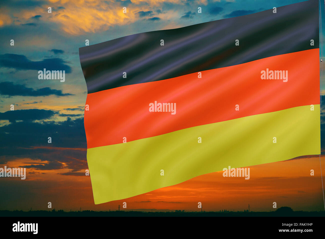 Flag of the Federal Republic of Germany flying against the evening a ...