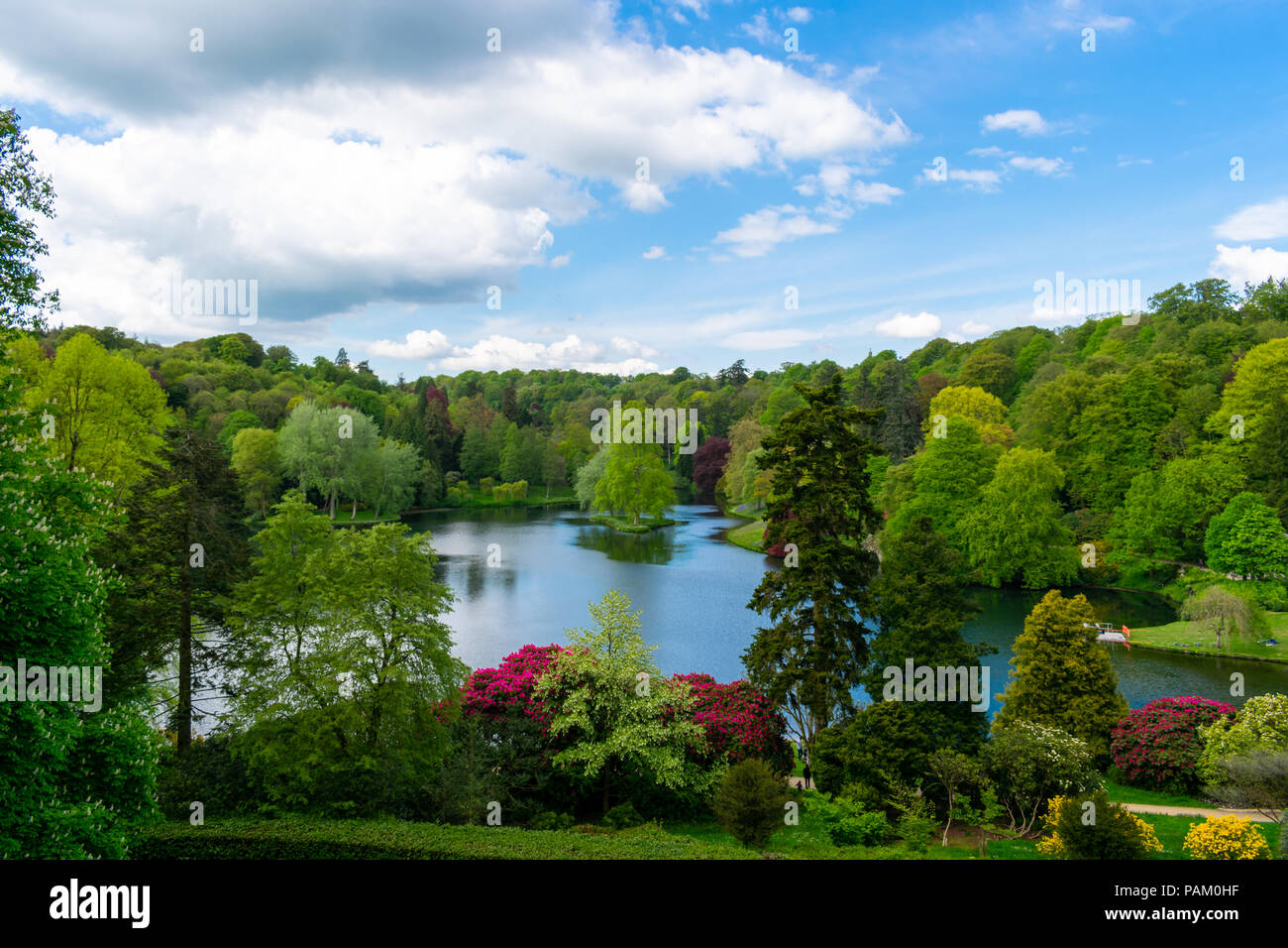 A photo of the centre lake at Stourhead national park surrounded by ...