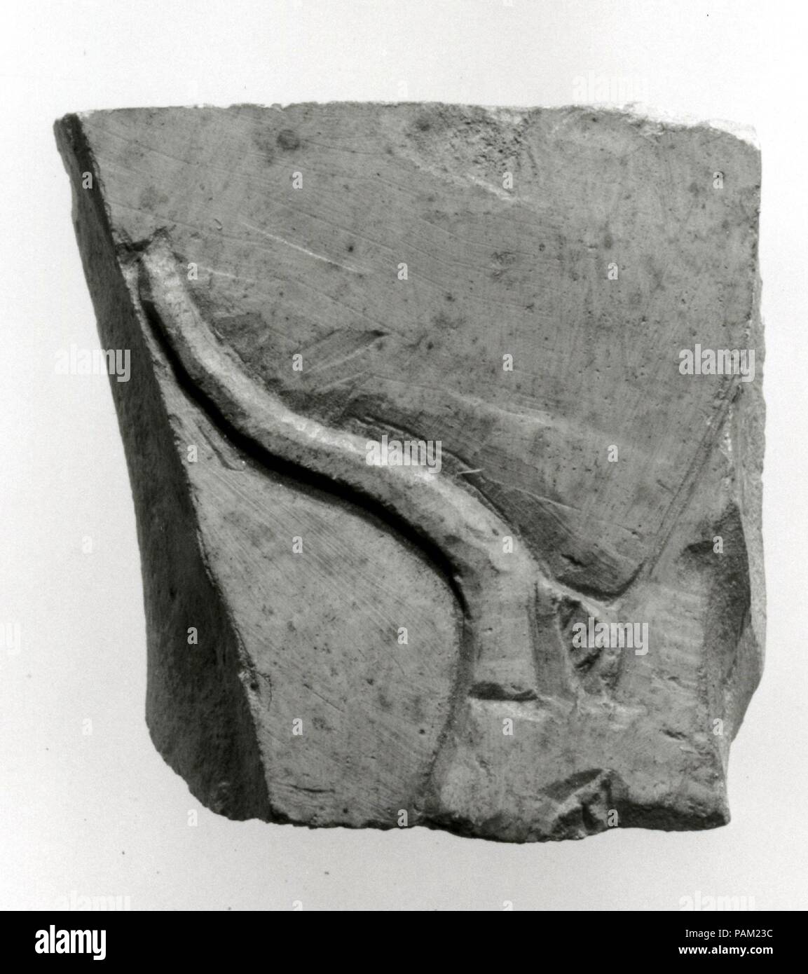 Raised relief fragment. Dimensions: 4 / 2.5 x 4 x 1. Dynasty: Dynasty ...