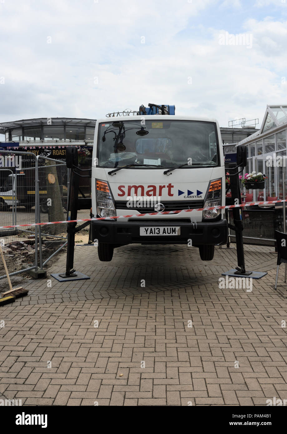 Lorry raised on outriggers in paved area in bury lancashire uk Stock ...