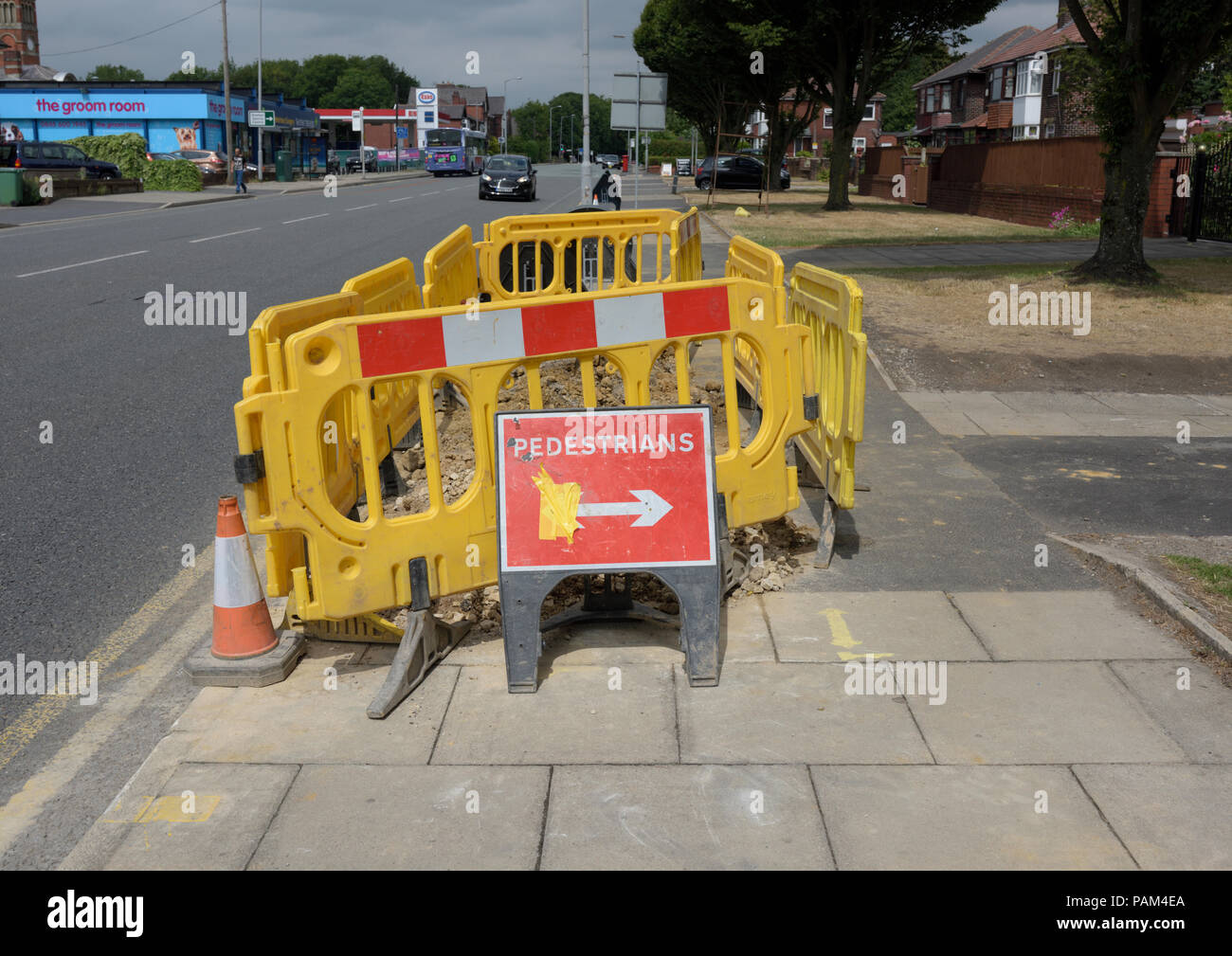 Temporary Red, pedestrians keep right sign on pavement in front of ...
