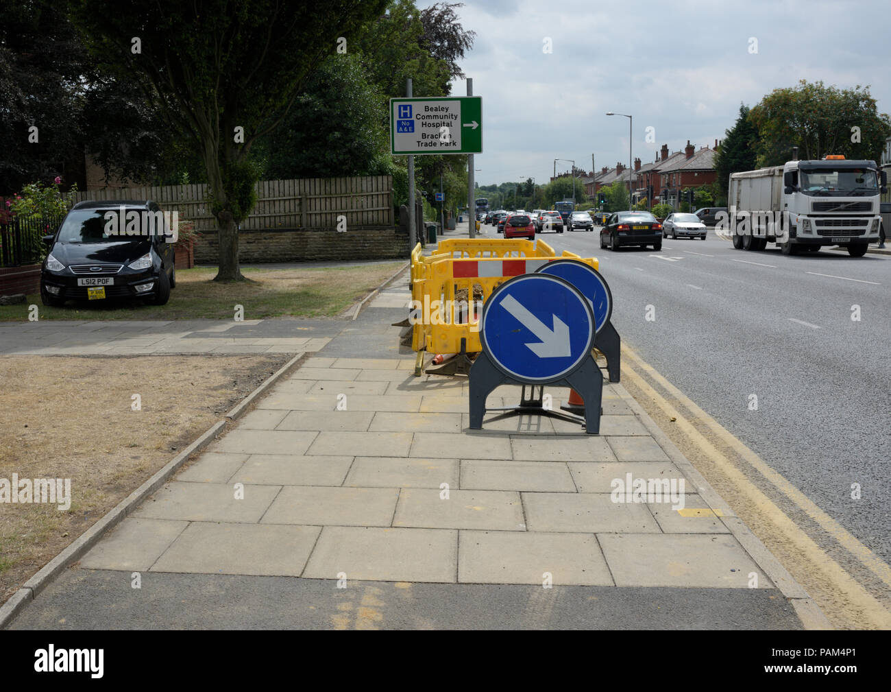Temporary Keep right roadworks sign, yellow plastic safety barriers on ...