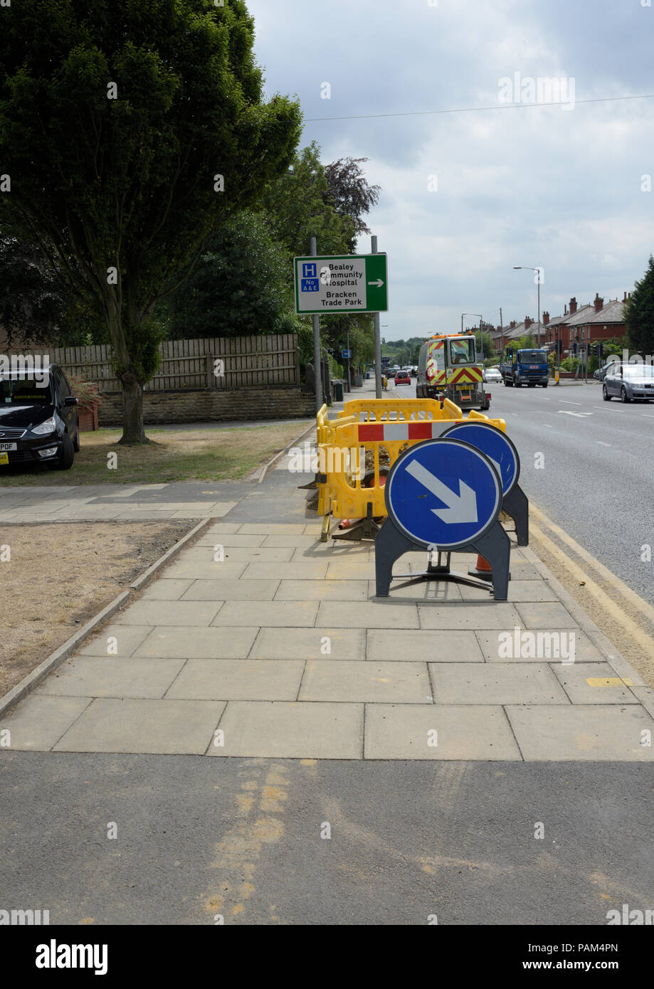 Temporary Keep right roadworks sign in front of yellow plastic safety ...
