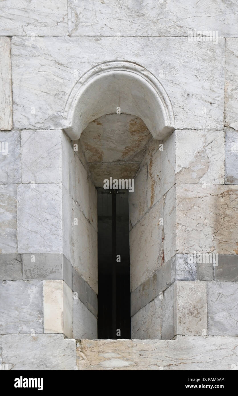 Small narrow window on old marble stone facade Stock Photo - Alamy