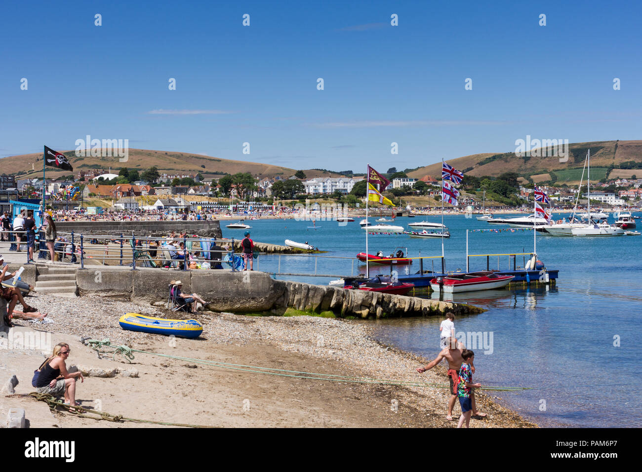 Visitors to Swanage enjoying the seaside on a warm sunny Sunday ...