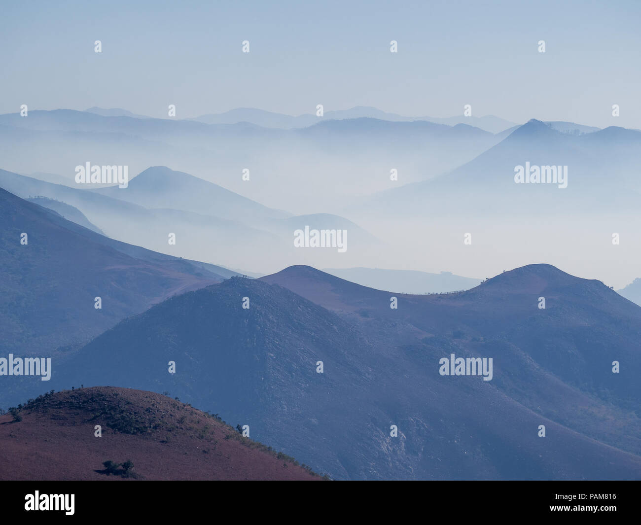 Hazy mountains and arid landscape of Malolotja Nature Reserve ...
