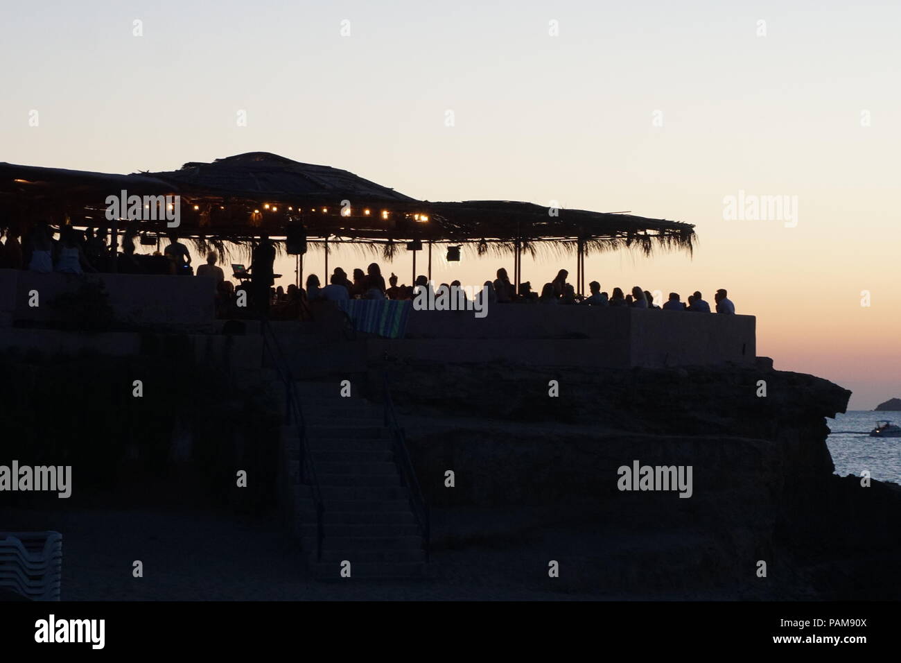 Sunset in Ibiza at Sunset Ashram bar Cala Conta Stock Photo - Alamy