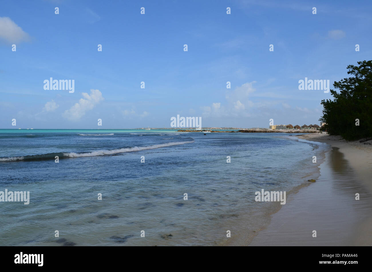 Gentle waves rolling ashore on an Aruban Beach Stock Photo - Alamy