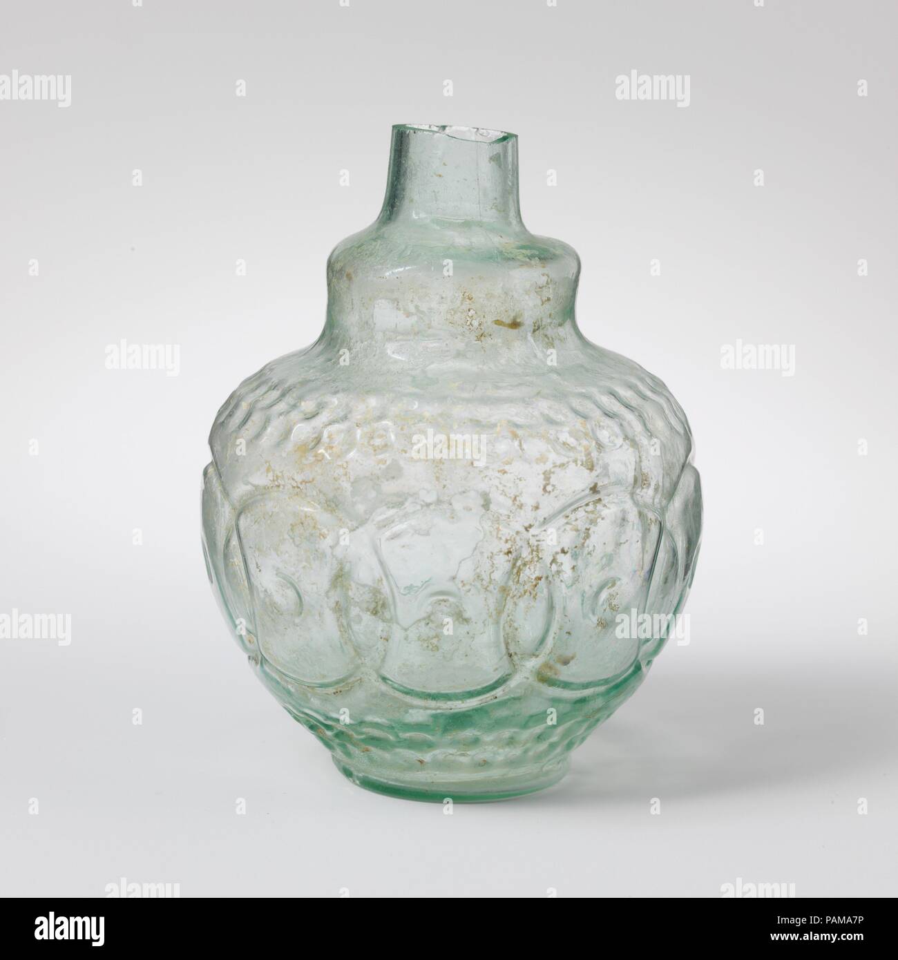 Glass flask decorated with intersecting circles. Culture: Roman ...