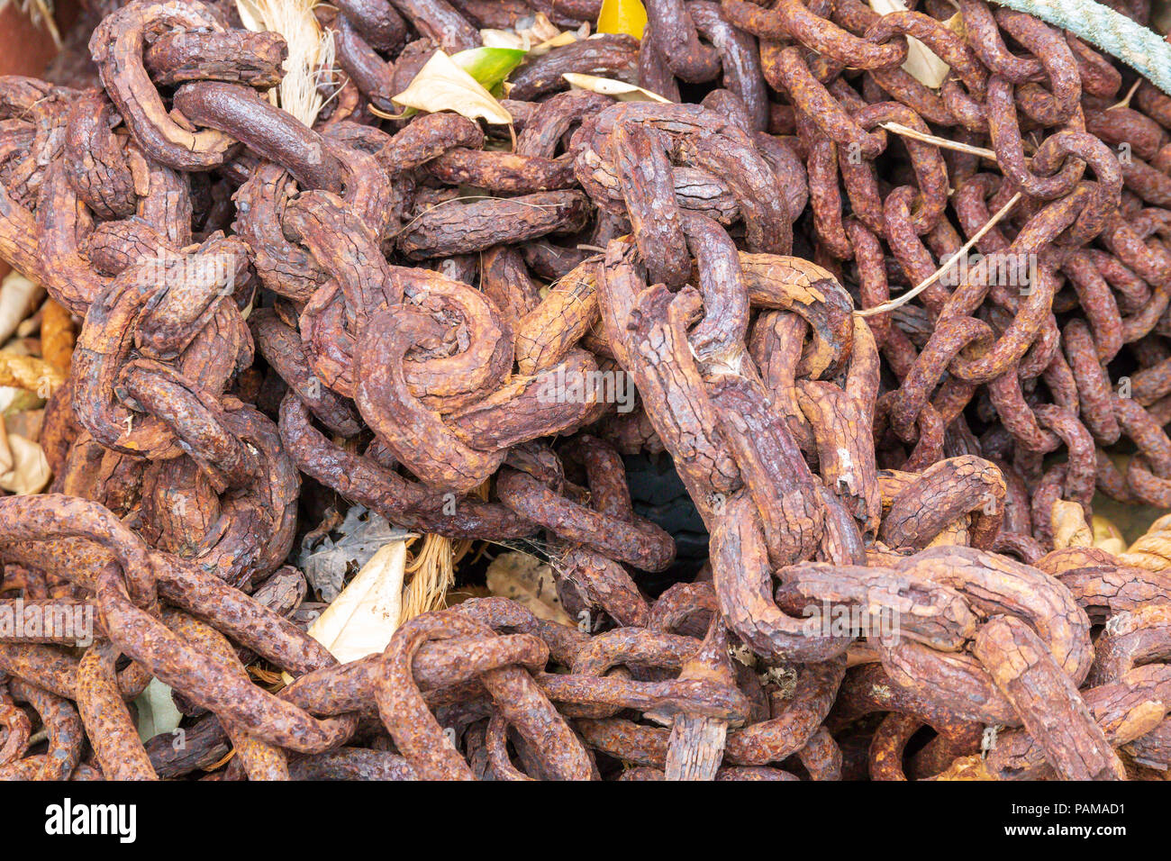 A pile of rusty chains weathered and decaying Stock Photo - Alamy