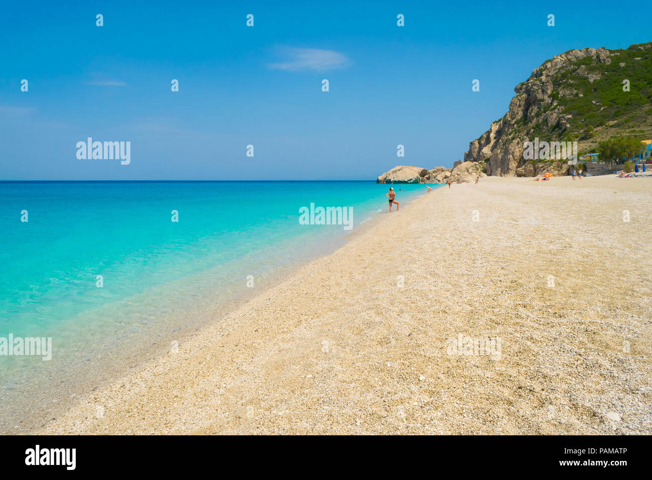 Crystal clear turquoise sea waters of a pebble beach. Kathisma beach in ...