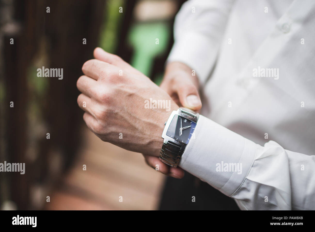 Man Wearing Silver Watch