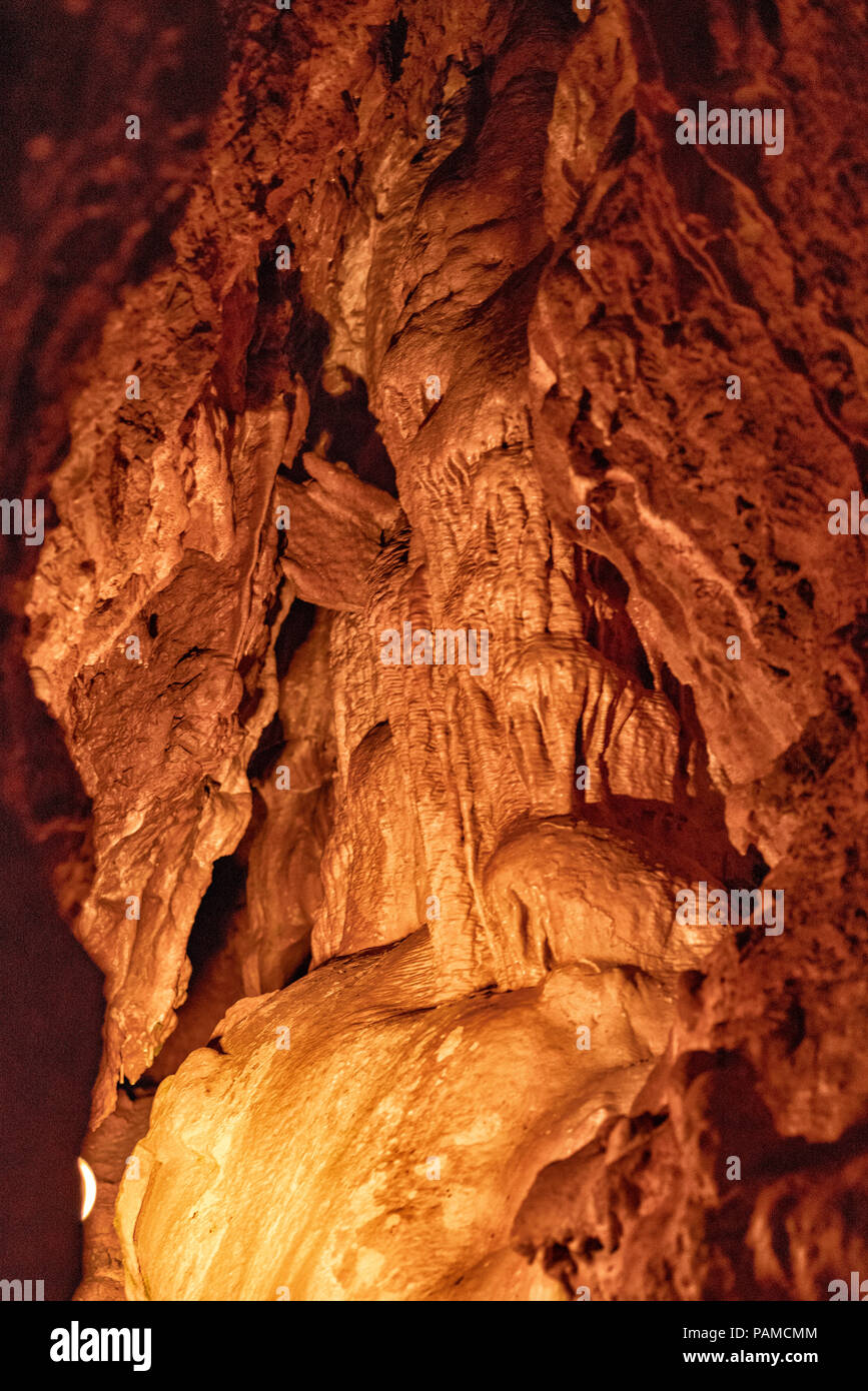stalagmite with color light in the cave Stock Photo - Alamy