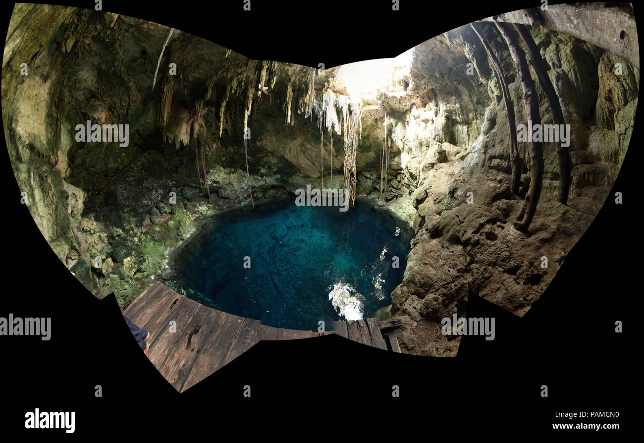 Top view of a cenote (underground river sinkhole) in Cuzamá, Yucatán ...