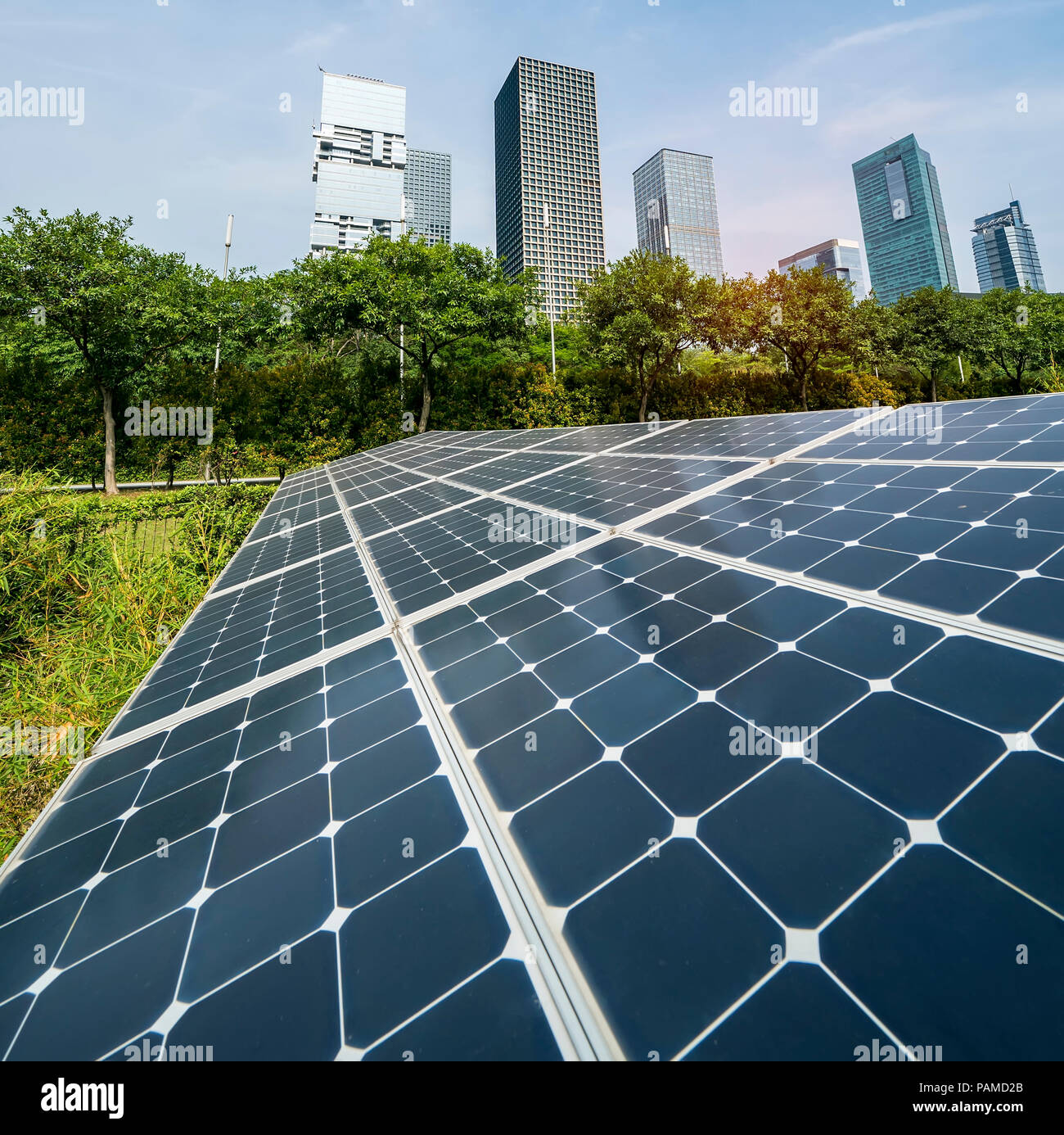 Ecological energy renewable solar panel plant with urban landscape ...